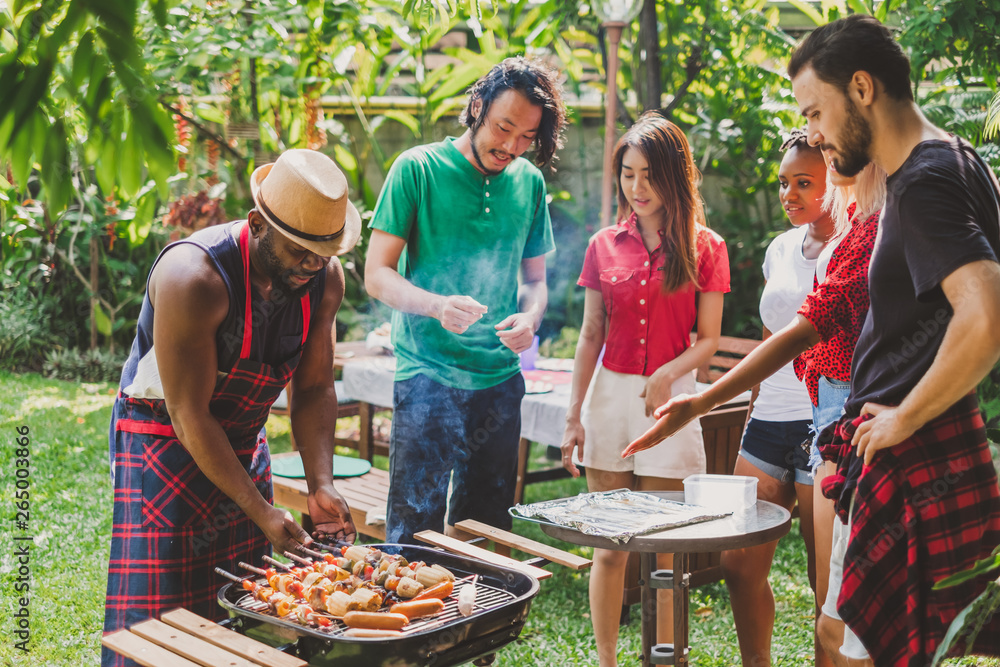 Group of diversity people having barbecue/barbeque party at home ...