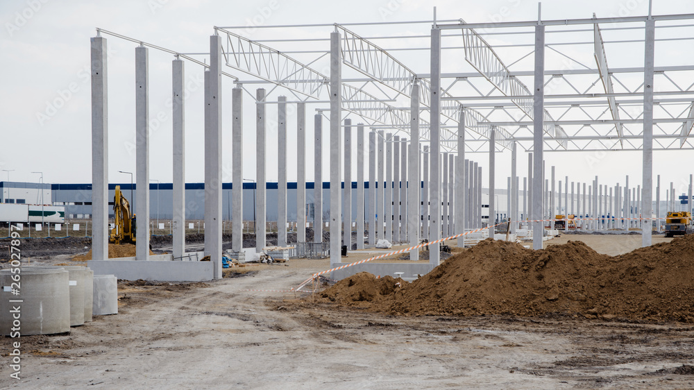 Concrete poles for the construction of the warehouse. Building a new ...