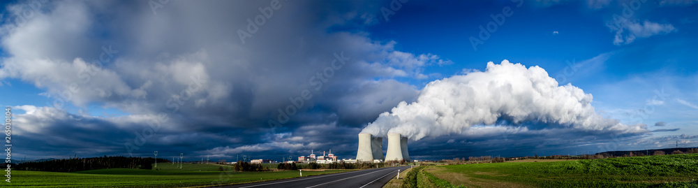 Nuclear plant and its cooling towers releasing a huge cloud of steam to ...