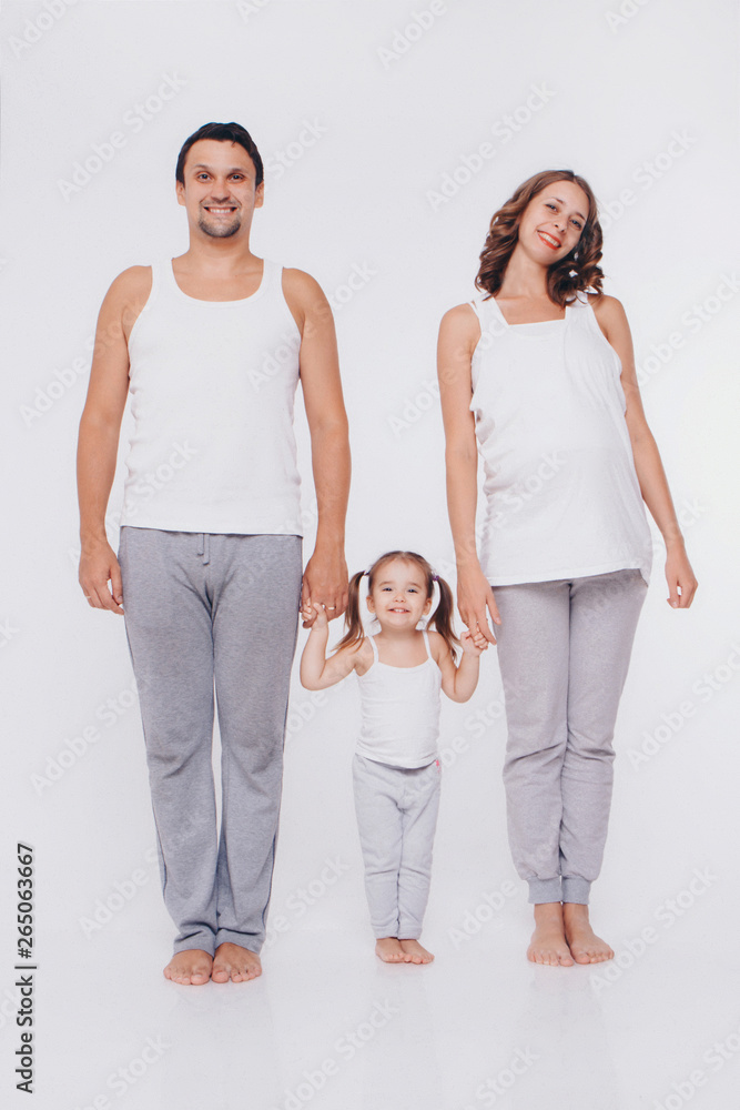 Cute baby learning to walk and make his first steps. mom is holding his ...