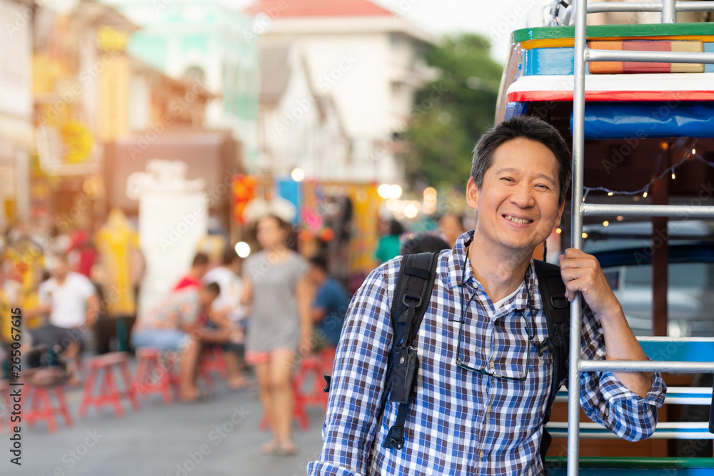 Tourist sightseeing old town ,traveling concept. Asian man with smiling ...