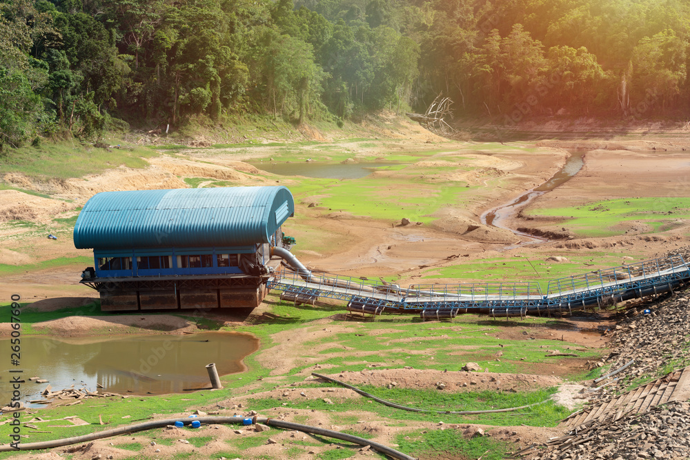 Crisis of water shortage in big dam ..Floating pump laying on the ...