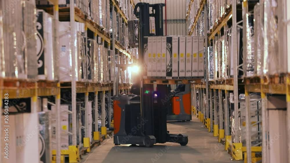 Forklift in a large modern warehouse, work of forklifts in a warehouse ...