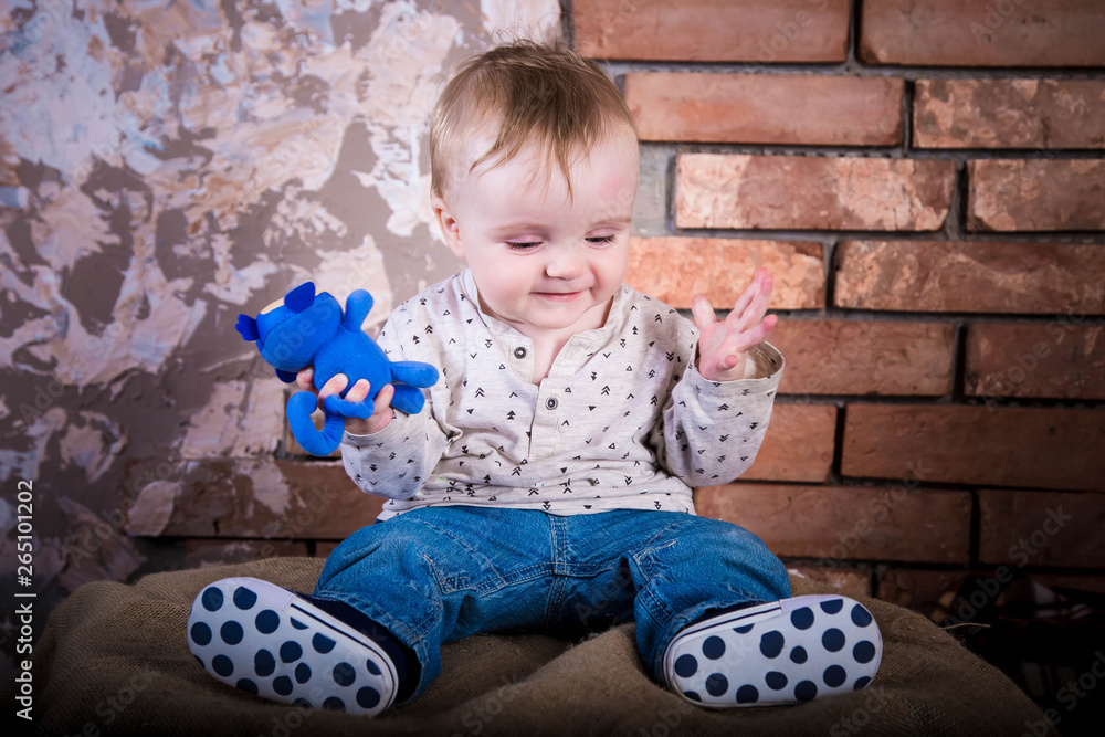 Small baby boy is confused and does not understand what is happening ...