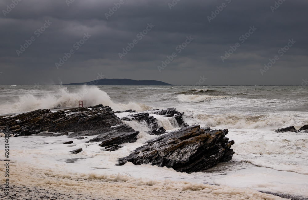 Stormy seas, waves crashes against rocks. Stock Photo | Adobe Stock