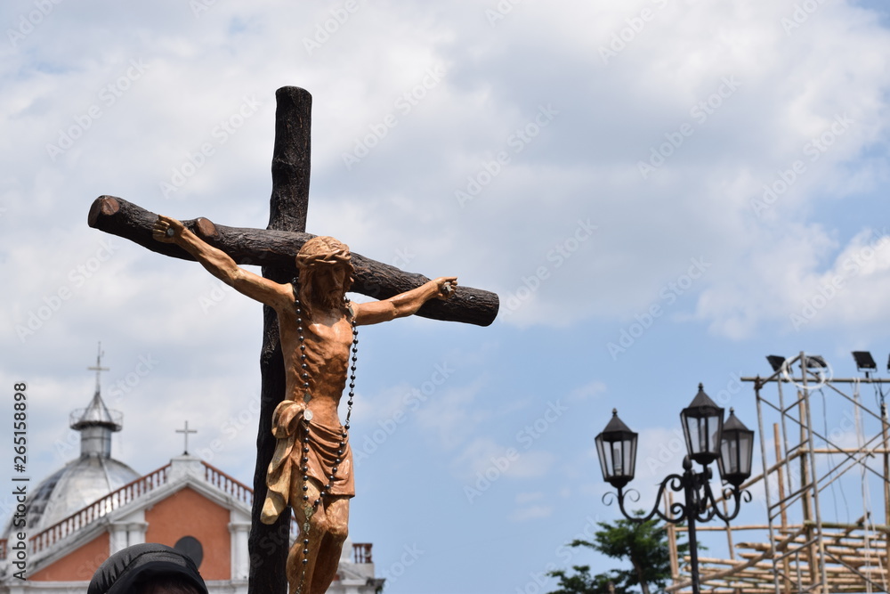 Huge crucifix carried by holy man, street drama, community celebrates ...