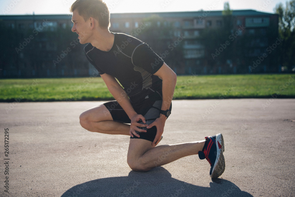 pain in the leg while running in the stadium. Trauma of the leg while ...