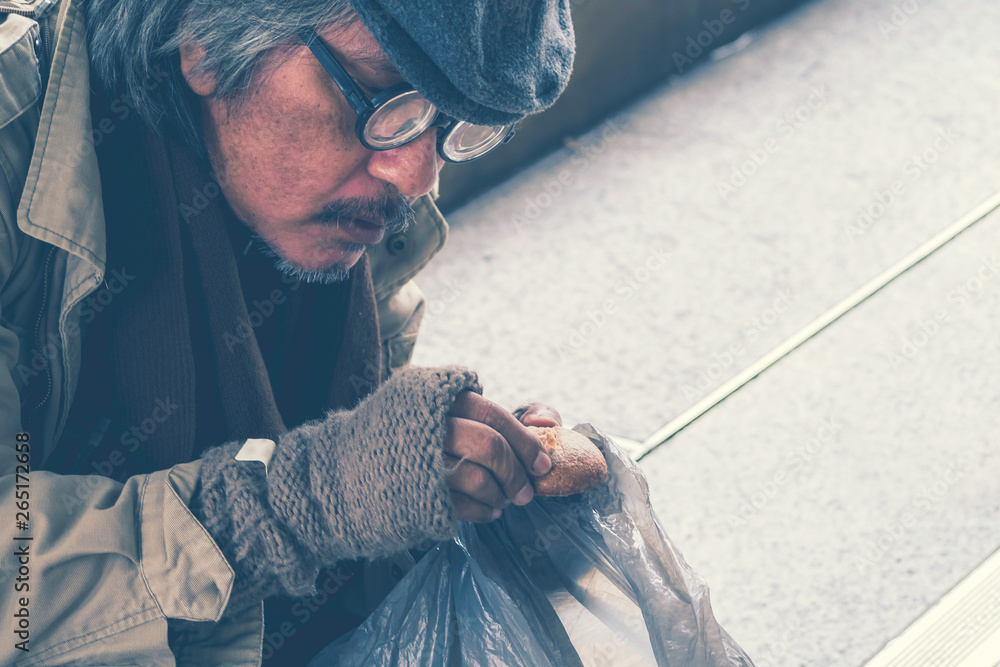 Man in need. Unhappy homeless man is holding hands to get help ...