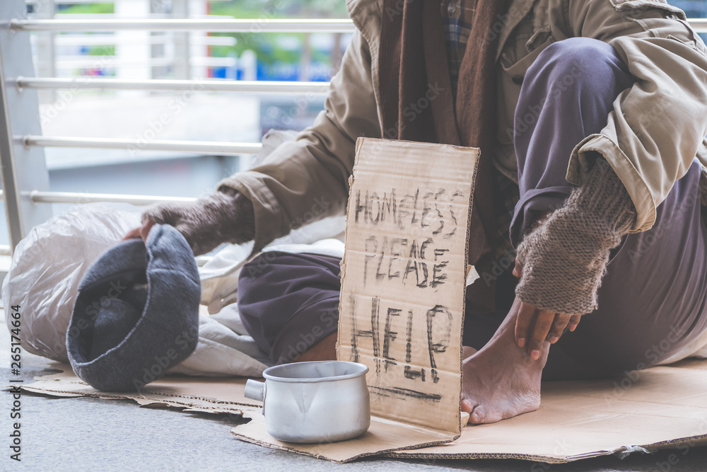 Man in need. Unhappy homeless man is holding hands to get help ...