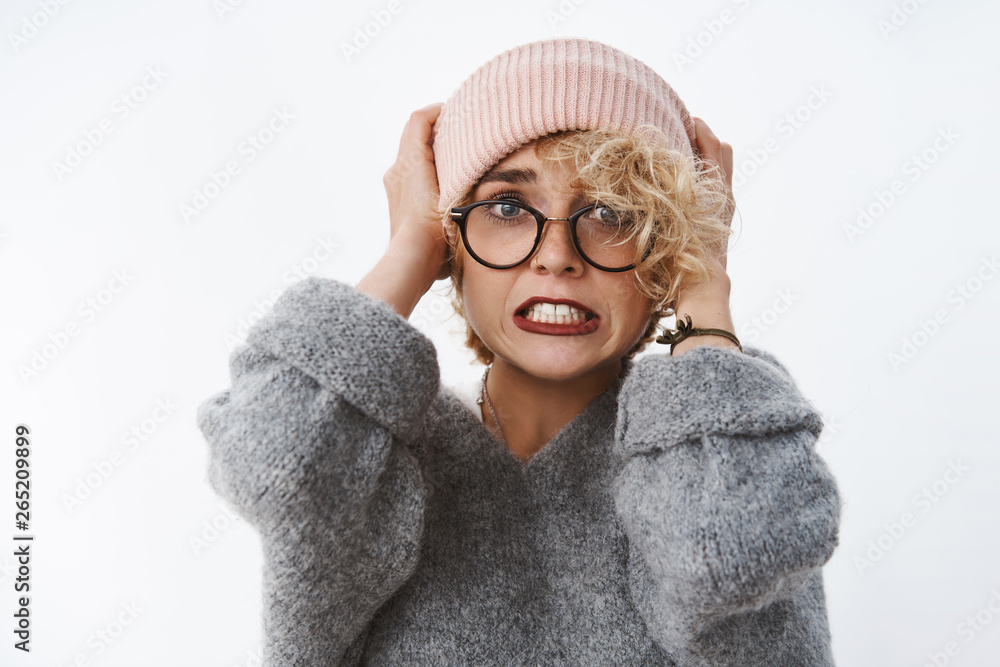Geez it freezing cold. Portrait of shocked displeased and panicking ...