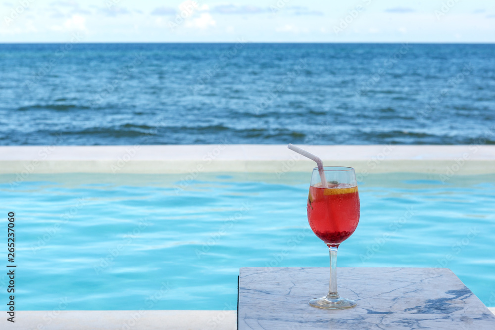 Cold drink By the pool in the resort on blurred nature on tropical ...