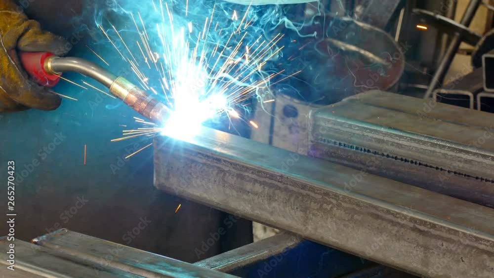 Blue Flame Welding of metals / Welding of steel parts in the metal ...