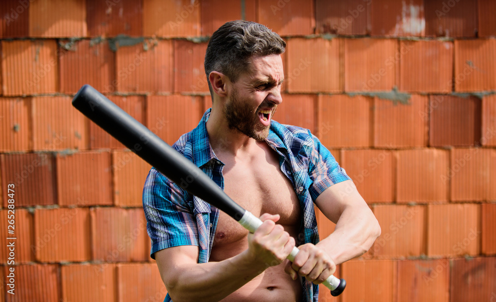 Attack concept. Bully guy carry cudgel brick wall background. Power and ...