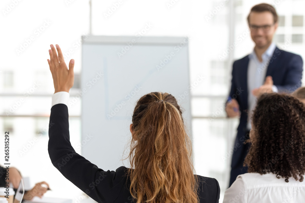 Training participant raise hand ask question at employees team workshop ...