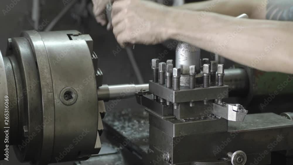 Men's hands with a Vernier caliper measuring the size of the details at ...