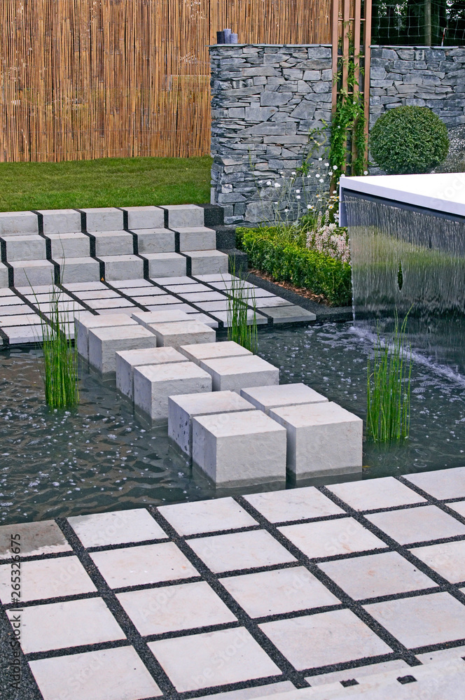 The contemporary water feature in the East meets West garden Stock ...