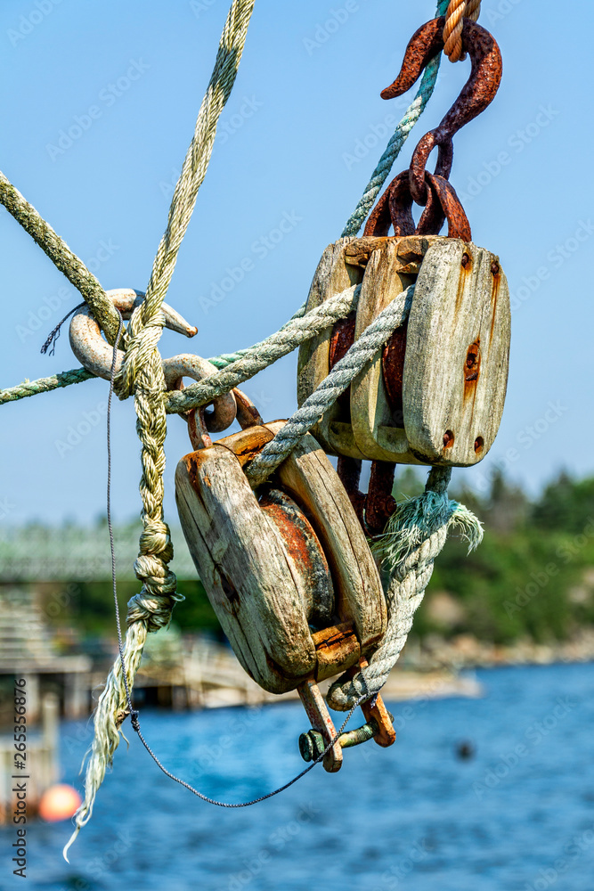Marine block and tackle at a wharf in a rural fishing community in Nova ...