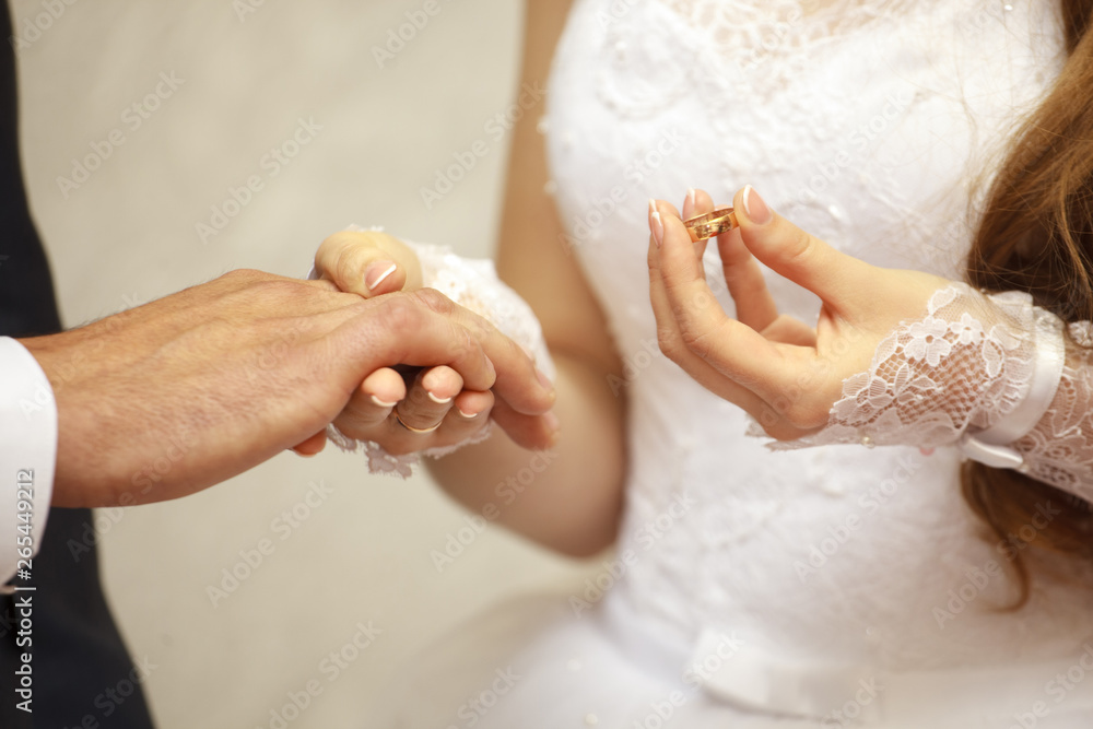 Wedding day. Ceremony. Wedding hands with rings. The bride's hand wears ...