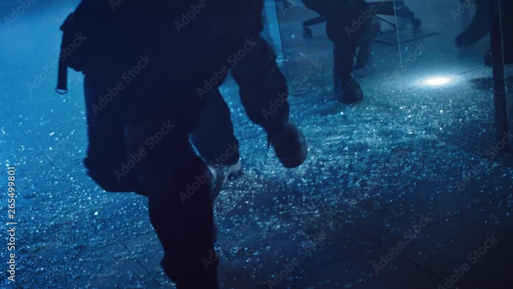 Close Up Leg Shot of a Squad of Armed SWAT Police Officers Moving ...