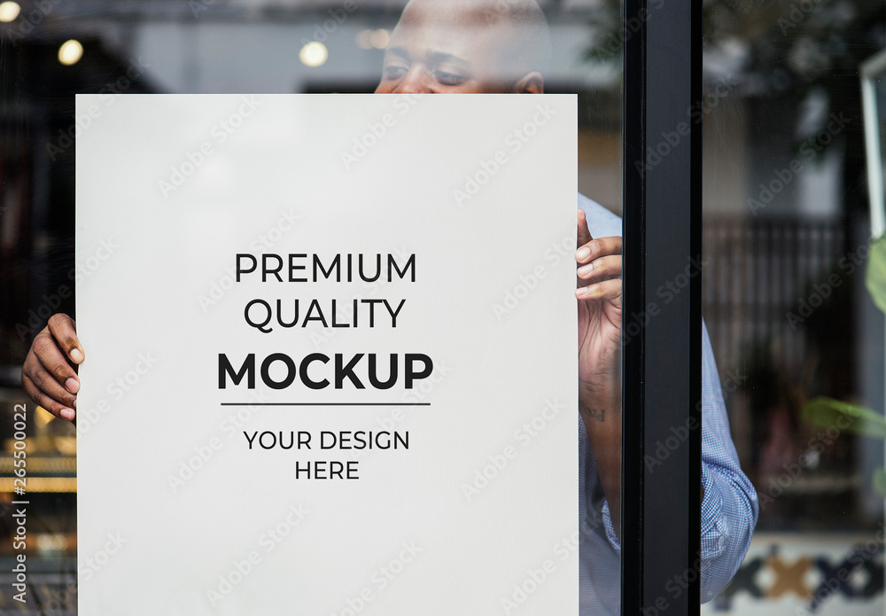 Person Putting Poster Mockup in Shop Window Stock Template | Adobe Stock