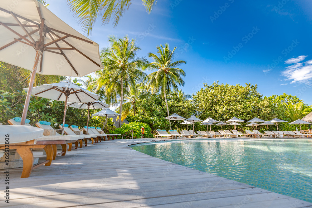 Luxury swimming pool in the tropical hotel or resort. Palm trees and ...