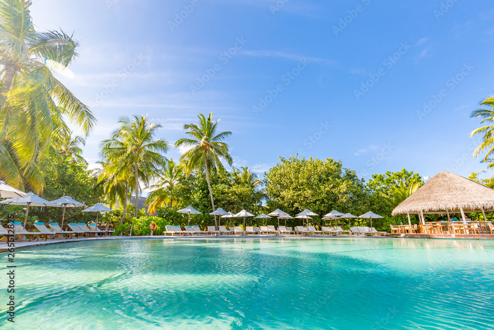 Luxury swimming pool in the tropical hotel or resort. Palm trees and ...