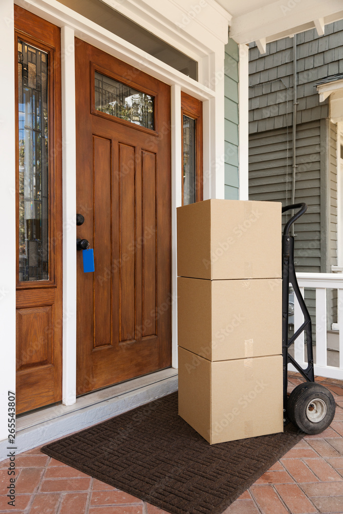 Cardboard boxes on front porch of house Stock Photo | Adobe Stock