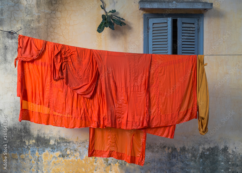Buddhist monk robes hanging on clothesline Stock Photo | Adobe Stock