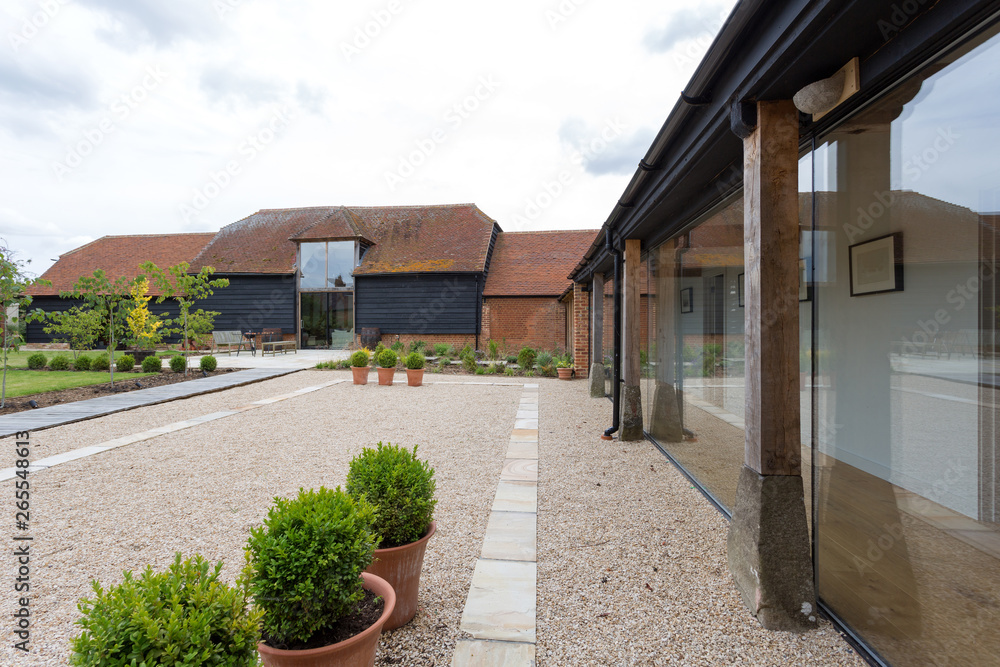 Courtyard of converted barn home Stock Photo | Adobe Stock