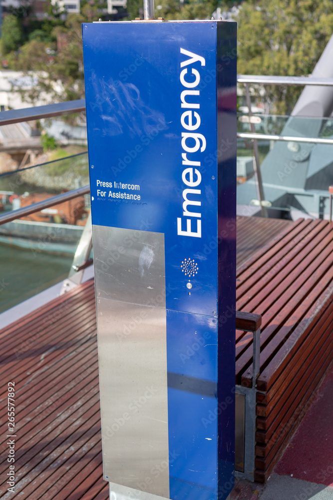 An emergency button telephone intercom system on a bridge near a public ...