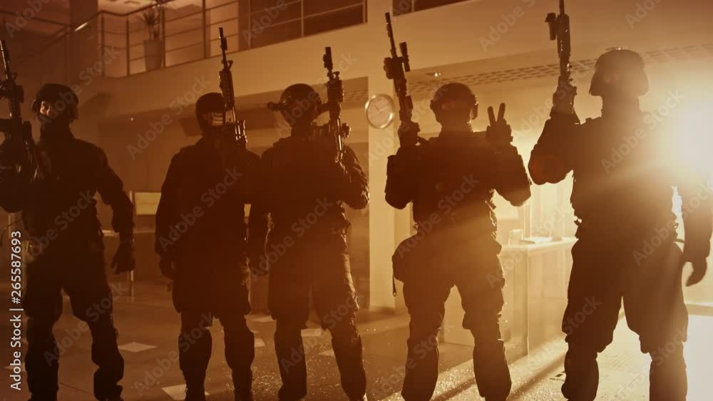 Masked Team of Armed SWAT Police Officers with Rifles are Posing After ...
