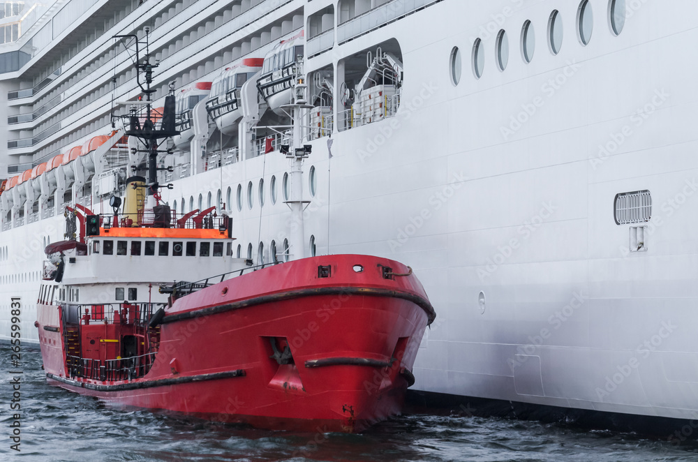 A RED SUPPLY VESSEL - Oil tanker is preparing to bunker fuel for a ...