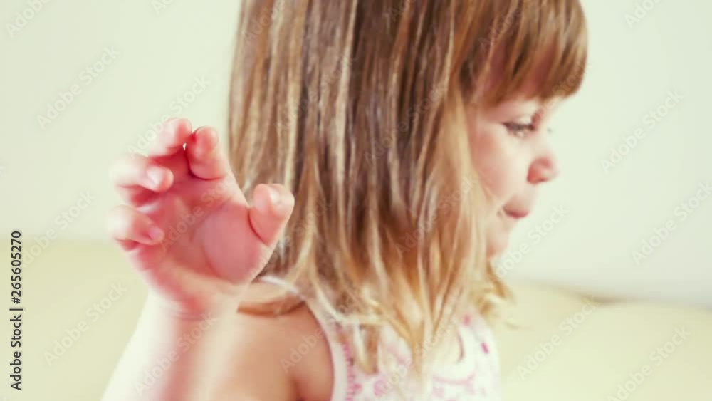 Little beautiful girl, baby infante, Caucasian. looks with his big blue ...