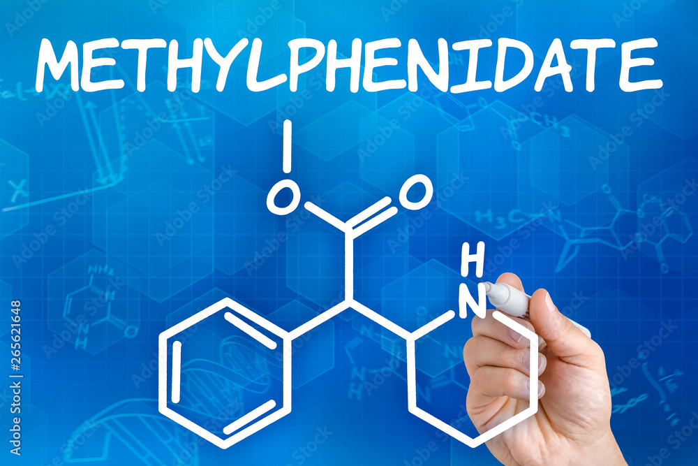 Hand with pen drawing the chemical formula of methylphenidate Stock ...