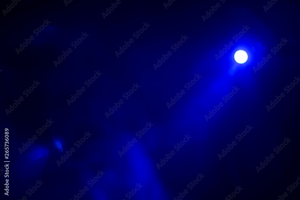 projector spotlight blue color , smoke texture background . light beam ...