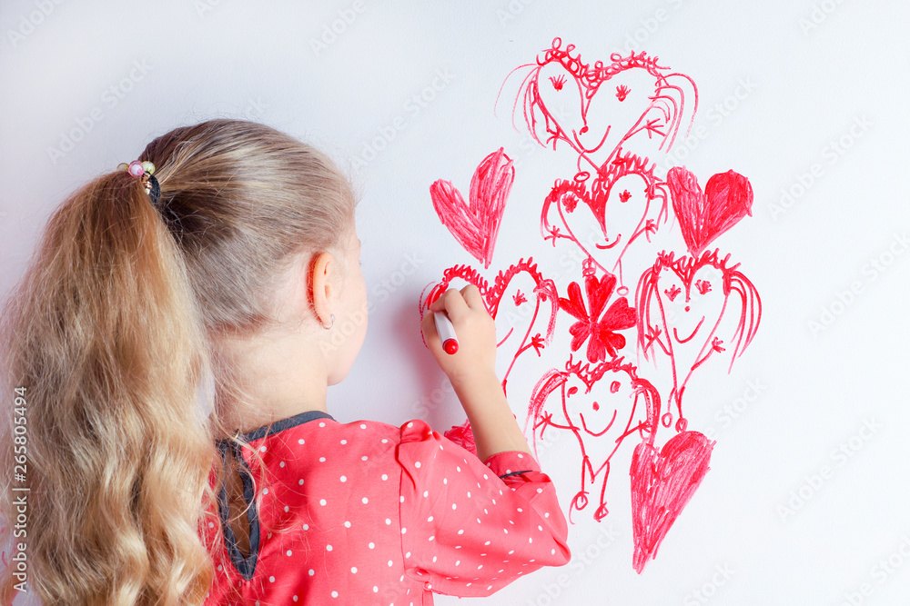 Little girl draws family with marker on a white board. Stock Photo ...