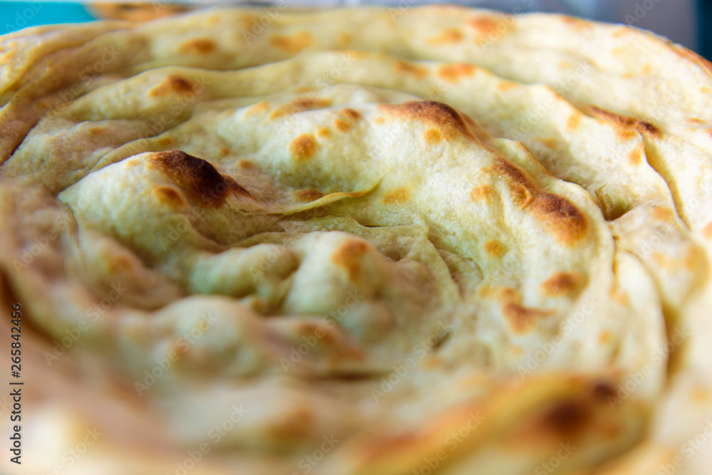 Lacha paratha, puff pastry. Traditional Indian flat bread paratha ...