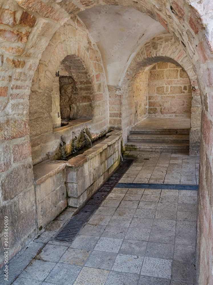 Ancient point with holy water spring in historical village of Ein Kerem ...