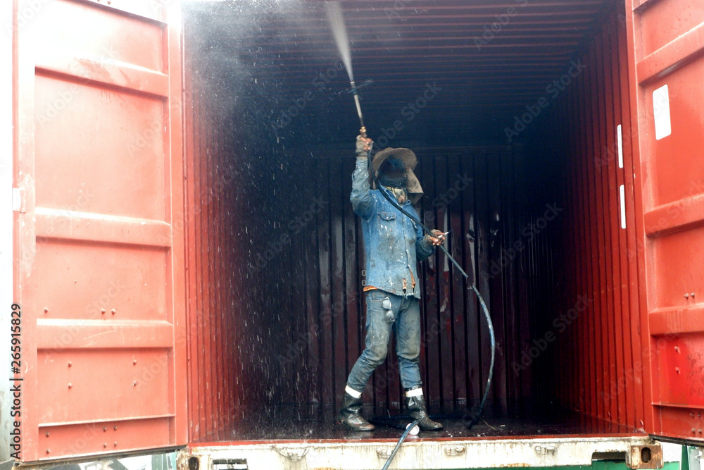 Workers are washing containers. From high pressure water Stock Photo ...