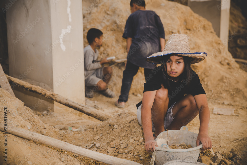 Little boys and girls labor working in commercial building structure ...