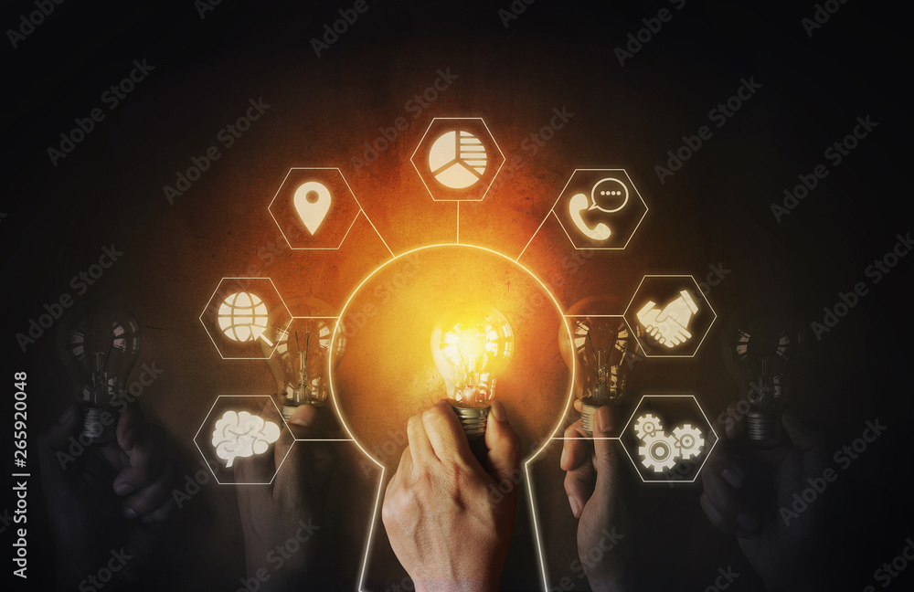 Hand with light bulb. Business Strategy Planning Stock Photo | Adobe Stock