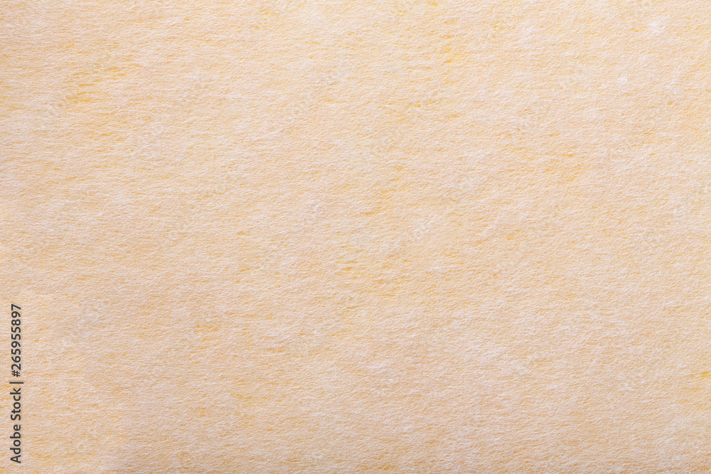 Light yellow and white background of felt fabric. Texture of woolen ...