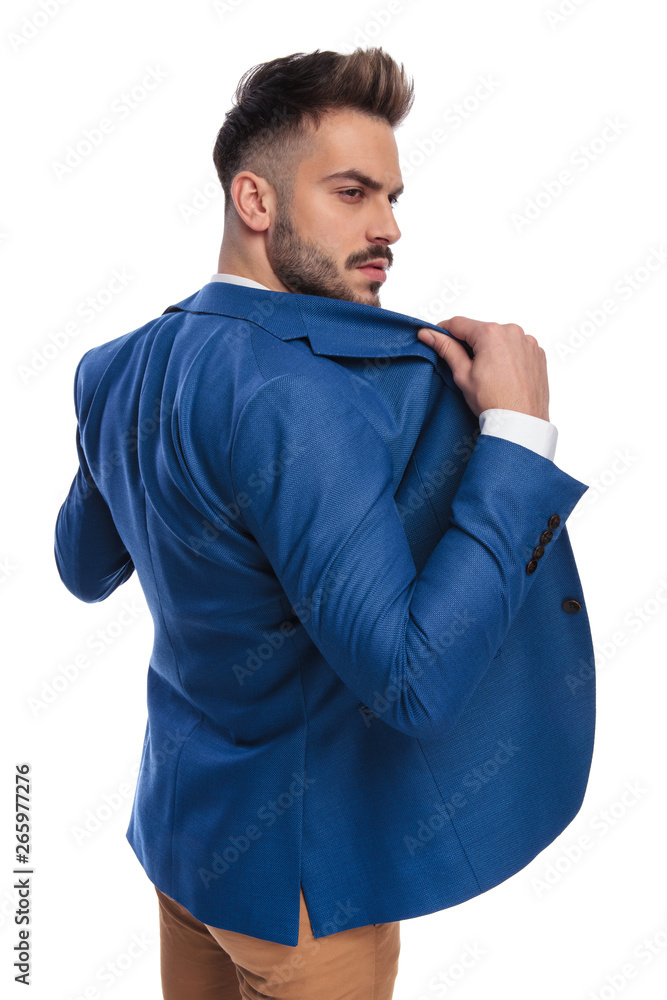 attractive man taking off or putting on his lounge jacket Stock Photo ...