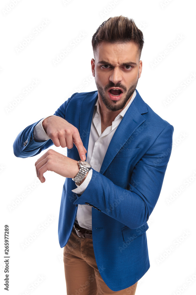 angry man pointing his finger to watch and screaming Stock Photo ...