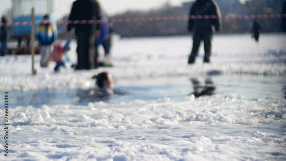 Bathing in cold ice water. Mass festive celebratory hardening, winter ...