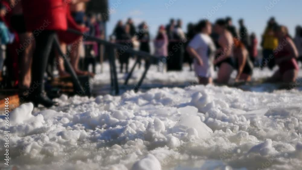 Bathing in cold ice water. Mass festive celebratory hardening, winter ...