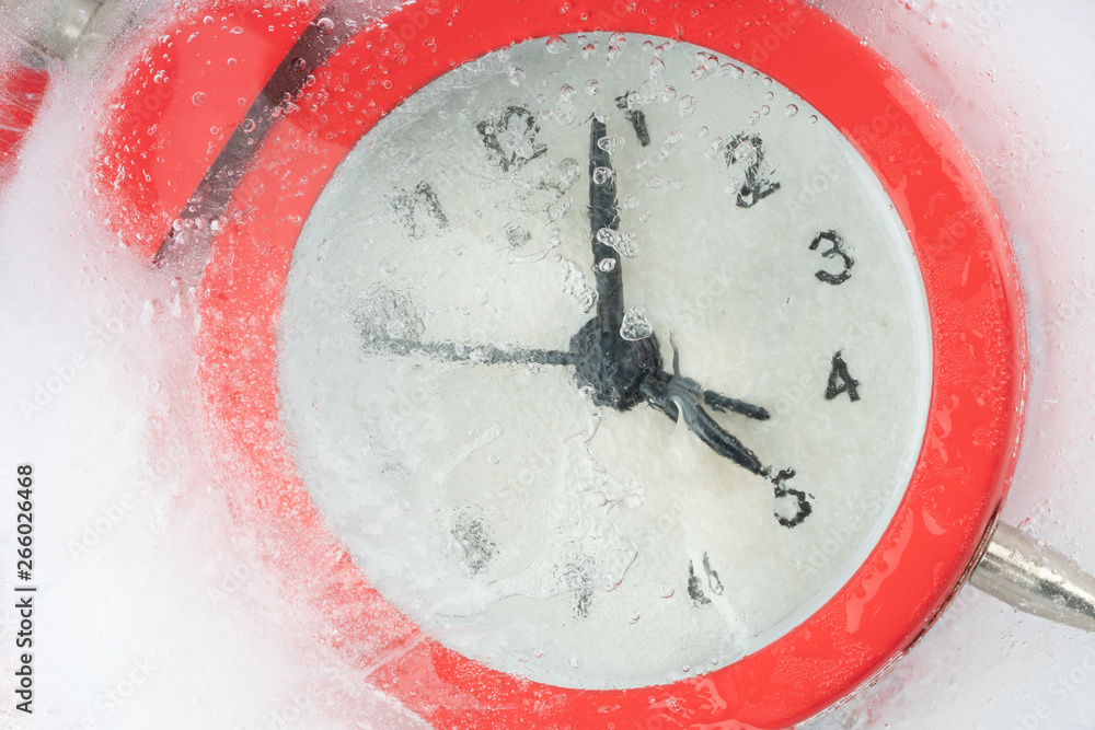frozen time in ice and red clock Stock 写真 | Adobe Stock