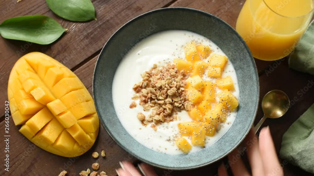 Mango Yogurt Breakfast Bowl With Granola And Chia Seeds. Concept Of ...