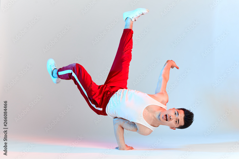 Isolated Korean hip hop male break dancer dancing on white background ...