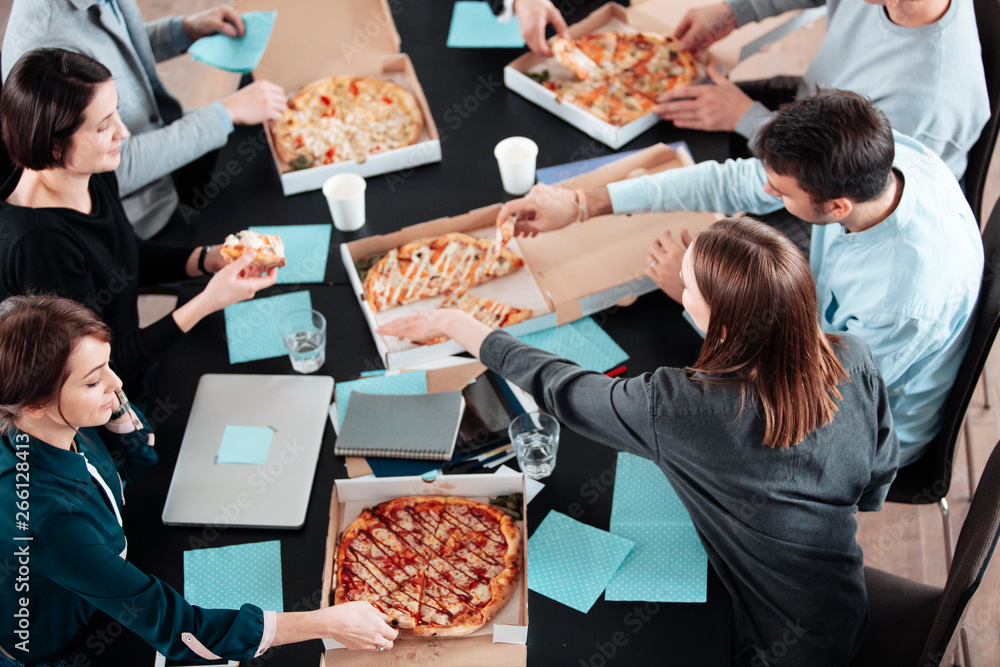 Multiracial group of international student talking to each other and ...